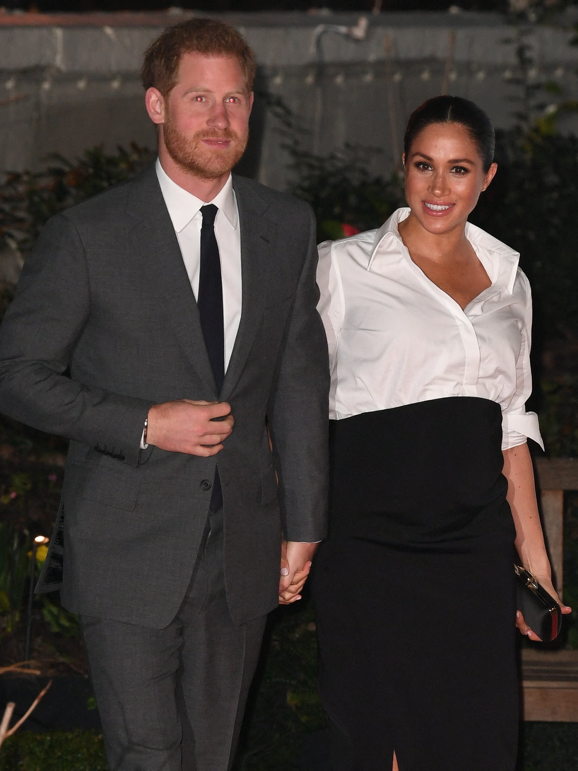 Prince Harry Acts Like Meghan Markle's 'Personal Bodyguard'